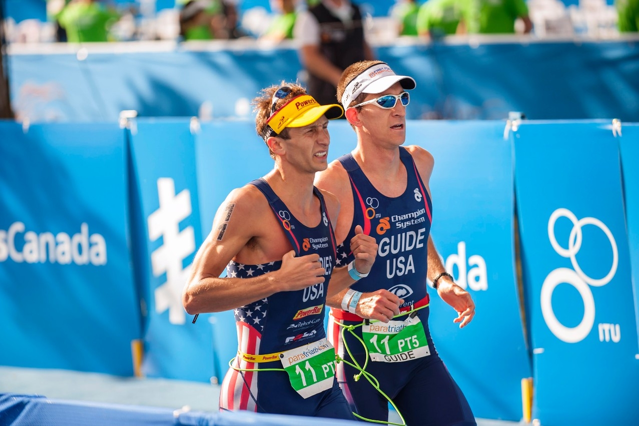 UC personal trainer Colin Riley guides legally blind athlete Aaron ...